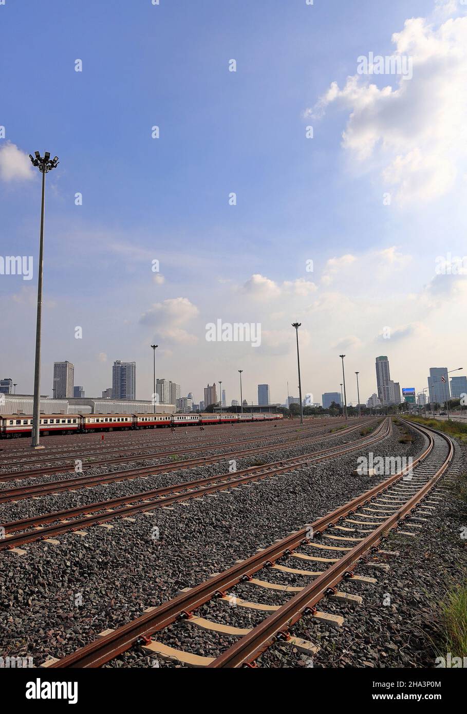 Empty rail tracks heading towards the City with blue sky, outdoor ...