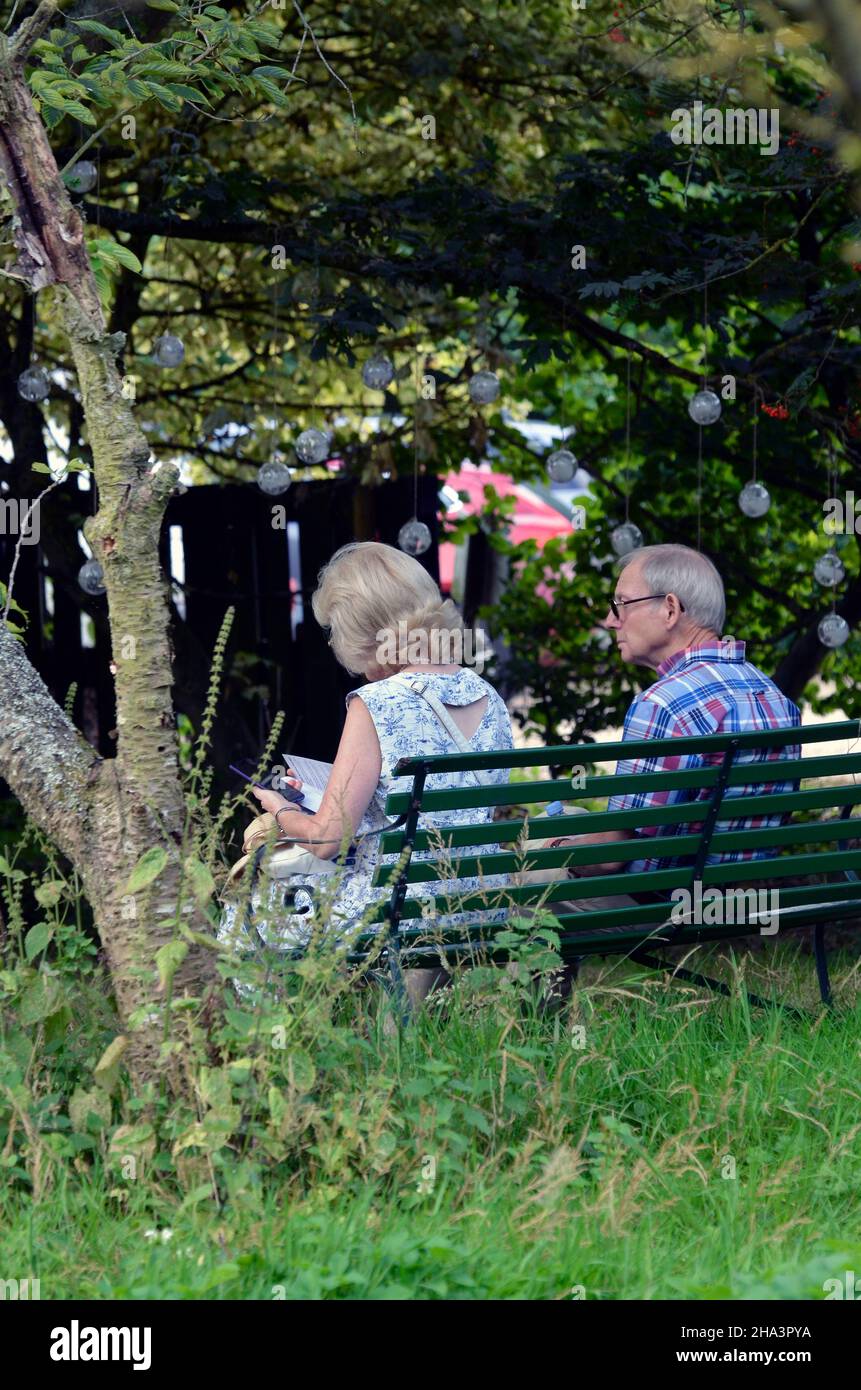 glass globes apppear to be hovering overhead of older couple Stock ...