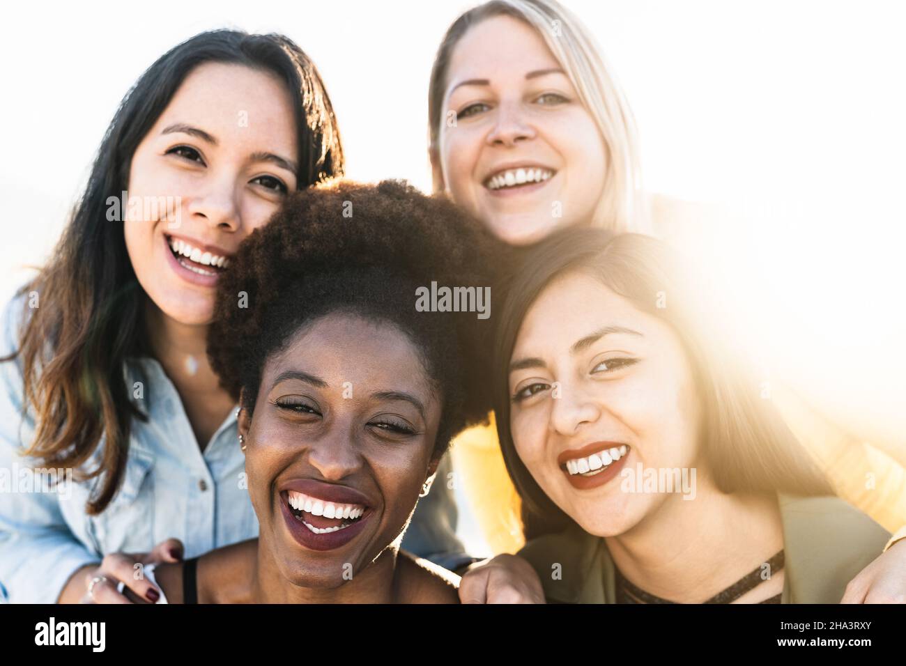 Portrait of happy multiracial women having fun outdoor Stock Photo - Alamy