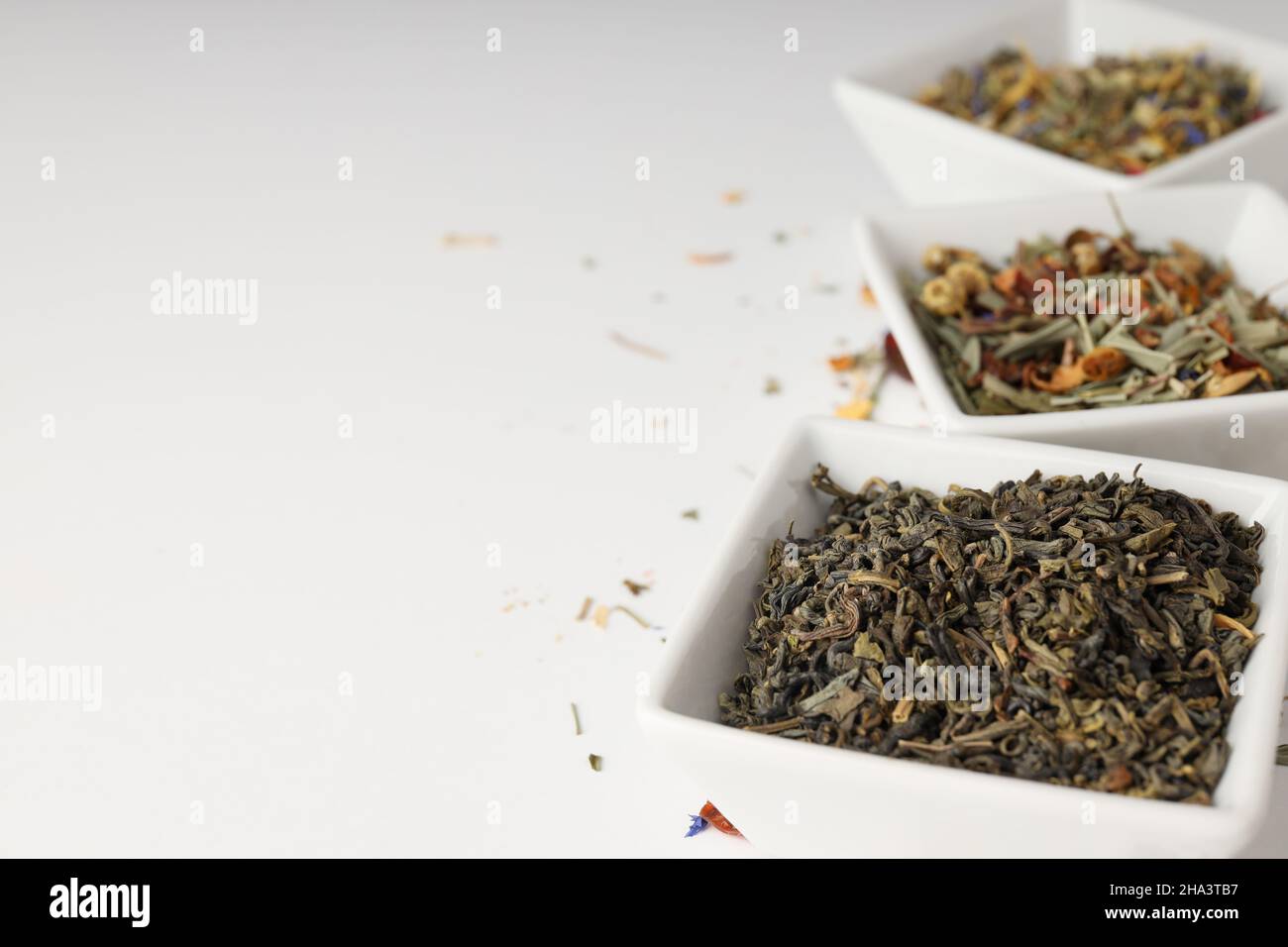 Concept of cooking tea with different types of tea on white background ...