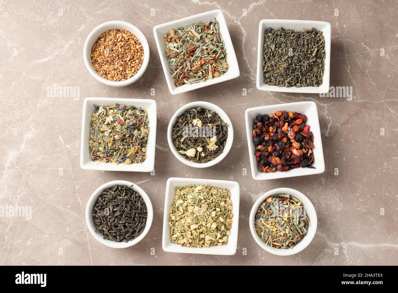 Flat lay with different types of tea on textured background Stock Photo ...
