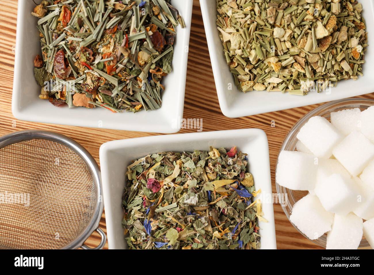 Concept of cooking tea with different types of tea on wooden background ...