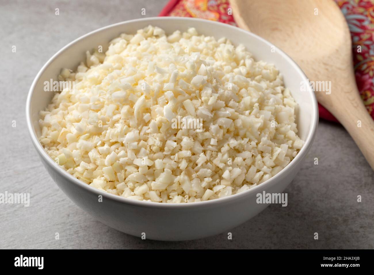Bowl with fresh raw cauliflower rice close up Stock Photo - Alamy