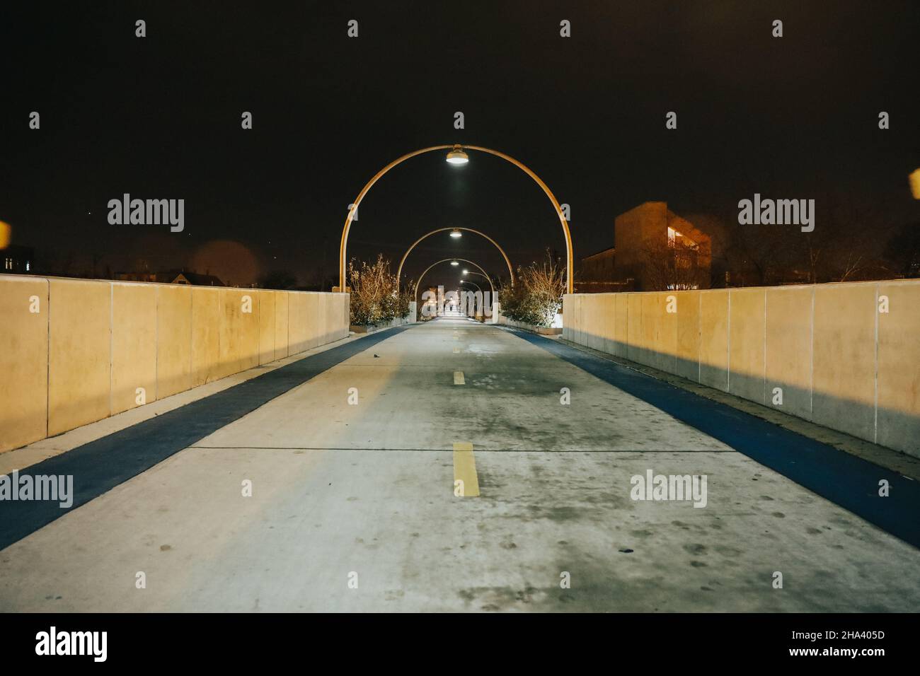 Empty suspension bridge at night Stock Photo - Alamy