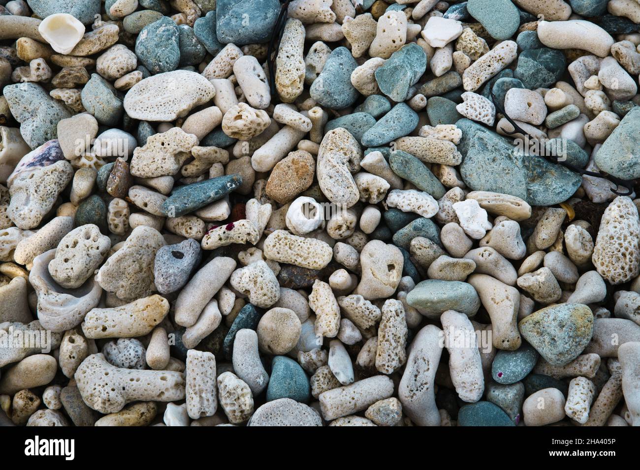Bunch of various colorful rocks at a beach during the day Stock Photo ...