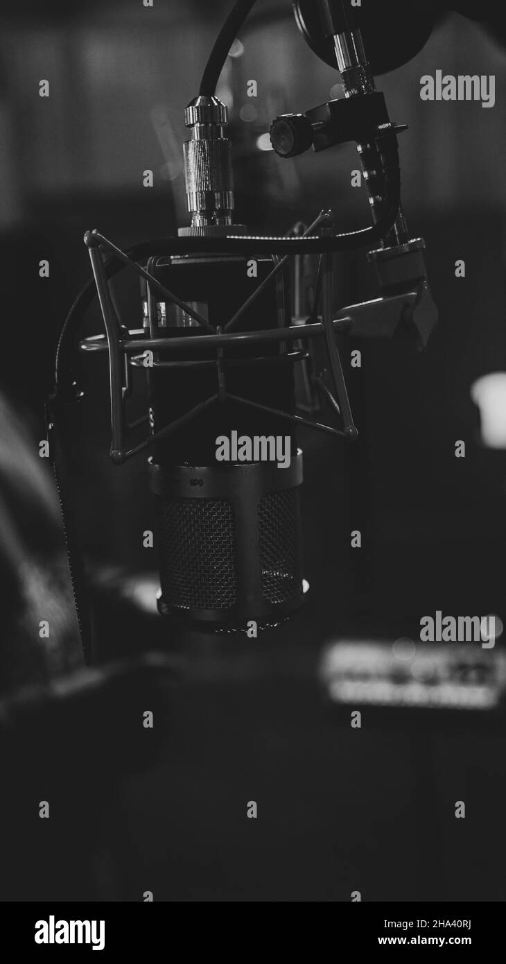 Grayscale closeup of a Studio Mic hung in a studio Stock Photo - Alamy
