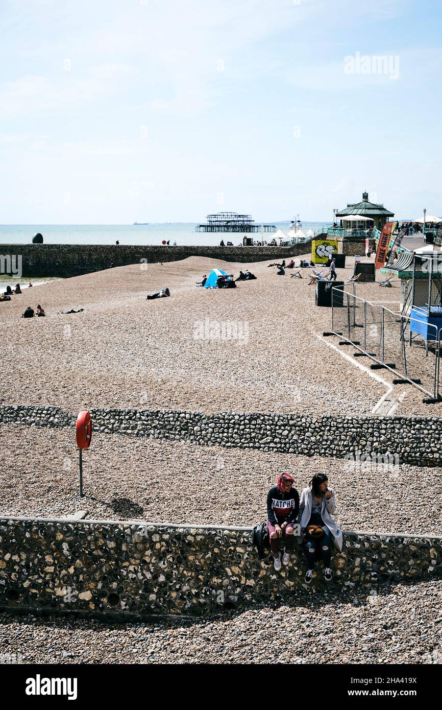 A view of Brighton Beach looking towards the burnt remains of West Pier ...