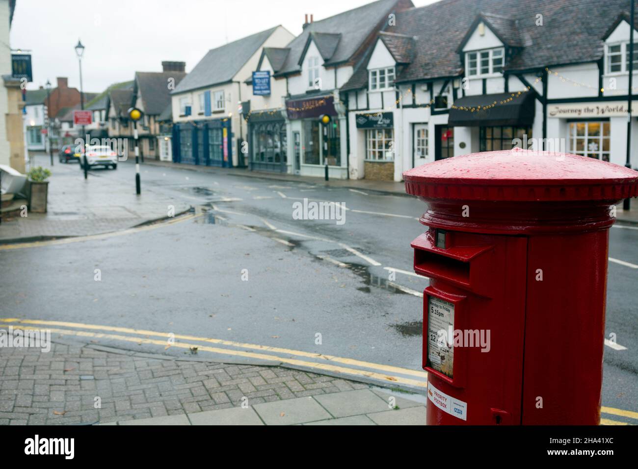 A post box in High Street on a wet winter`s day, Knowle, West Midlands ...