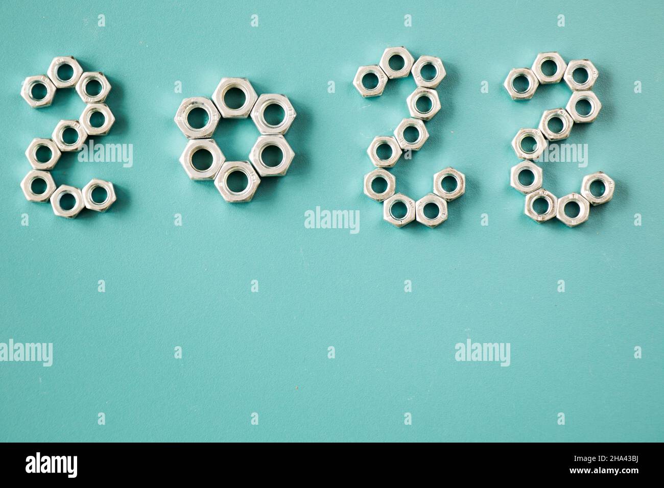 2022 New year numbers with bolts and nuts, building materials numbers ...
