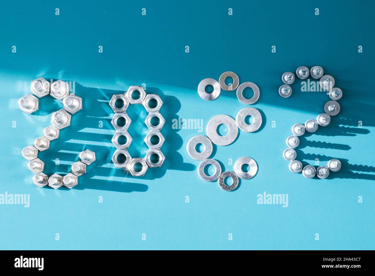 2022 New year numbers with bolts and nuts, building materials numbers ...