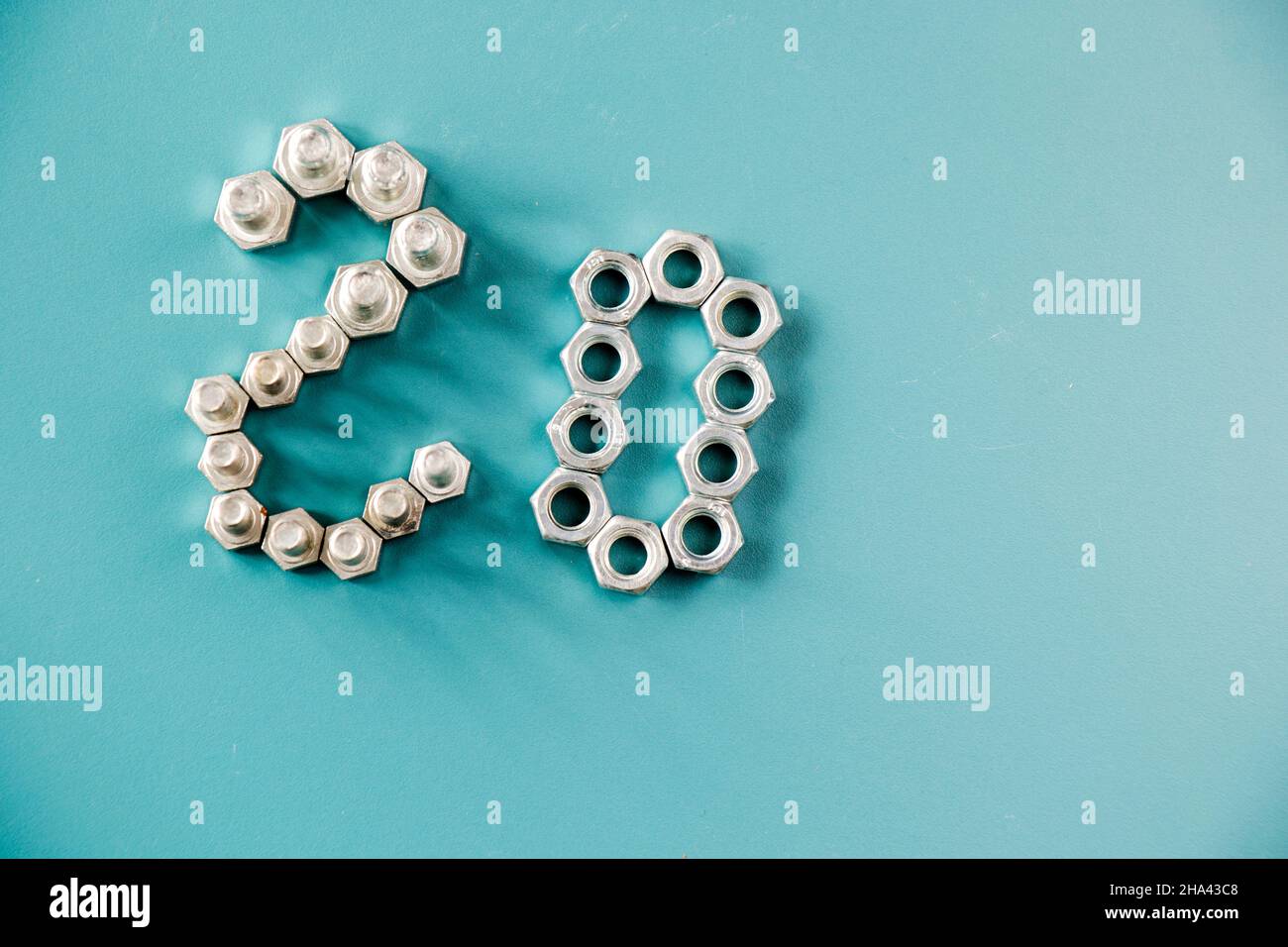 Number twenty with bolts and nuts on the blue background Stock Photo ...