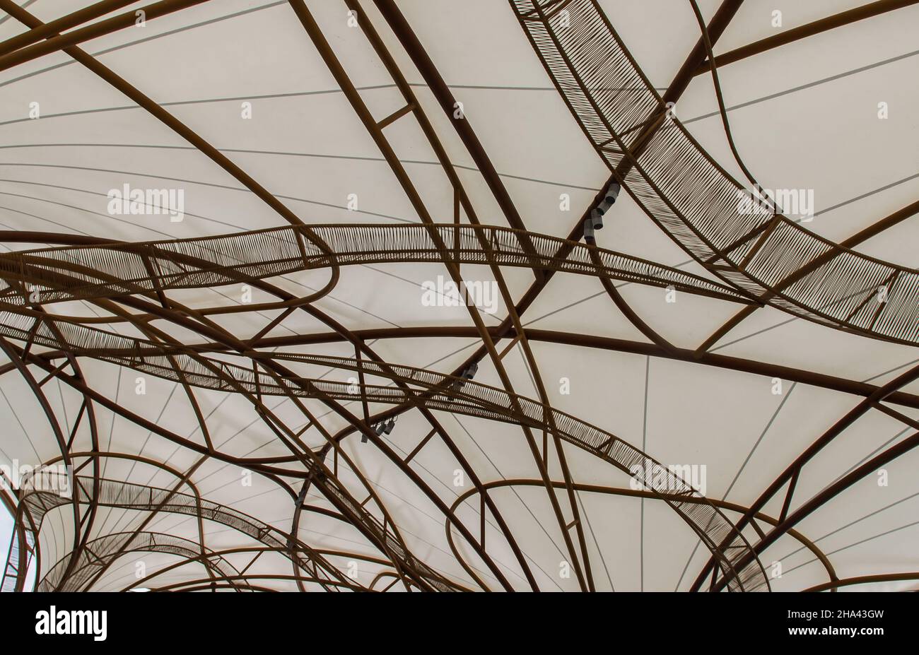 The pattern of steel frame umbrella underside detail with white cloth ...