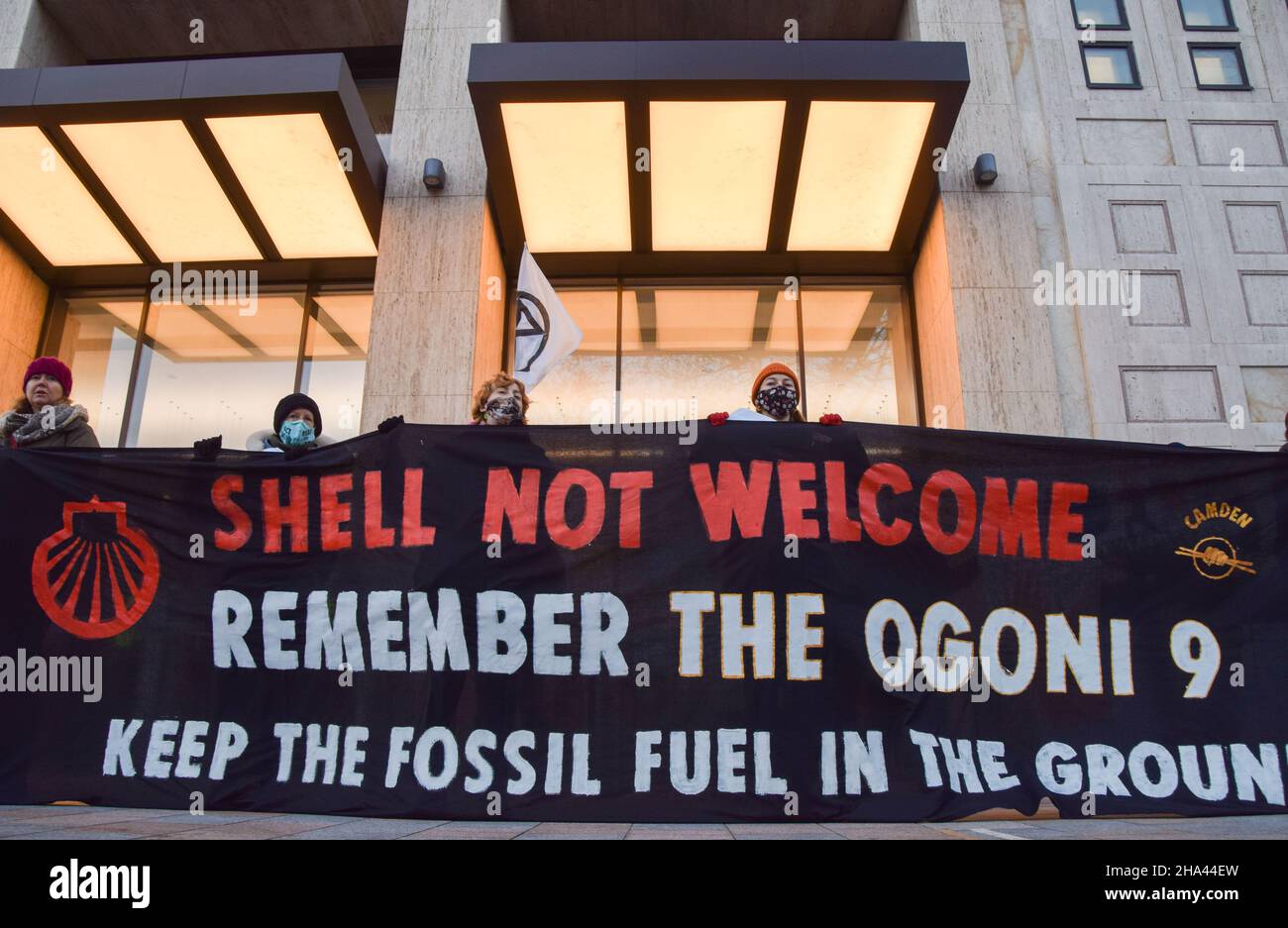 Protesters hold a 'Shell Not Welcome' banner referencing the Ogoni Nine ...