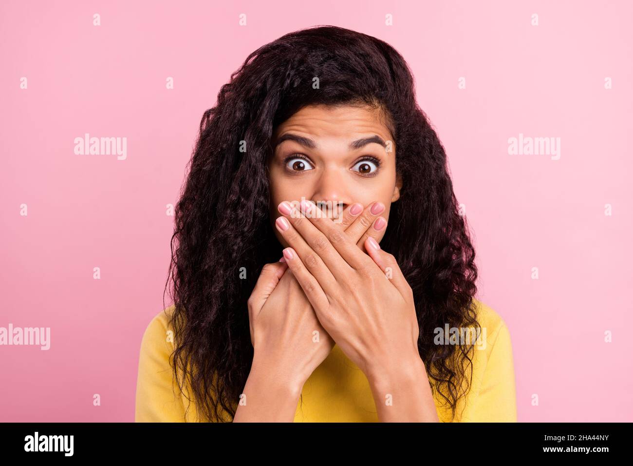 Photo of young afro girl close mouth hands oops fail mistake talk ...