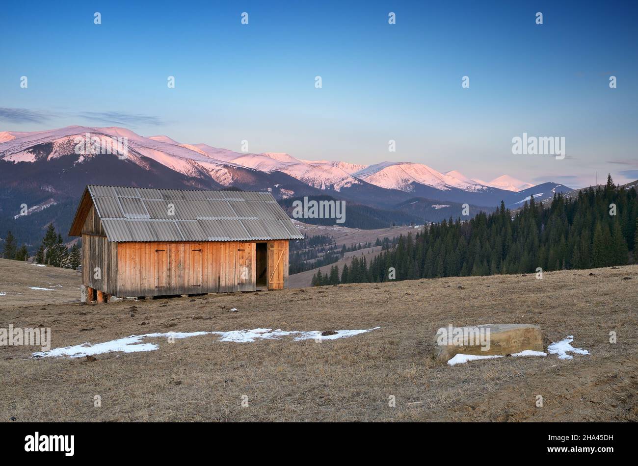Spring landscape with small wooden house for hay. Carpathian mountains ...