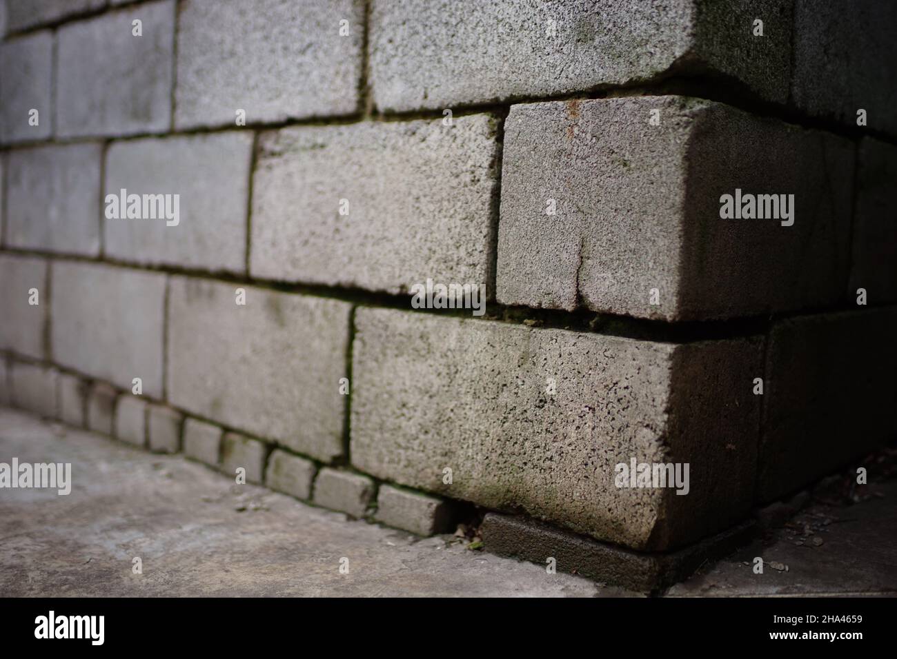 Grey cinder block wall with wet seams. Perspective close up view Stock ...
