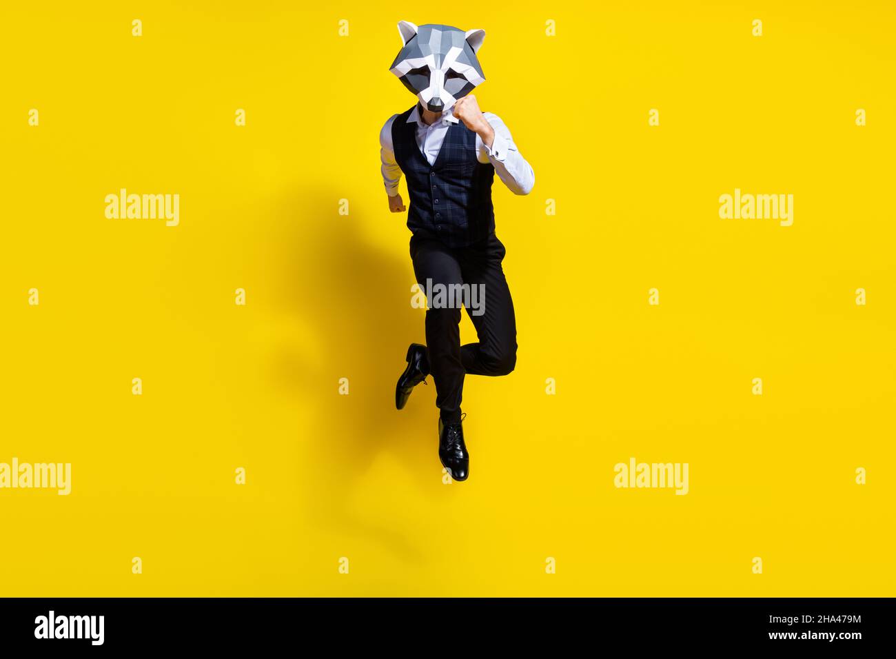 Full body photo of absurd weird guy racoon mask jump run hurry discount ...