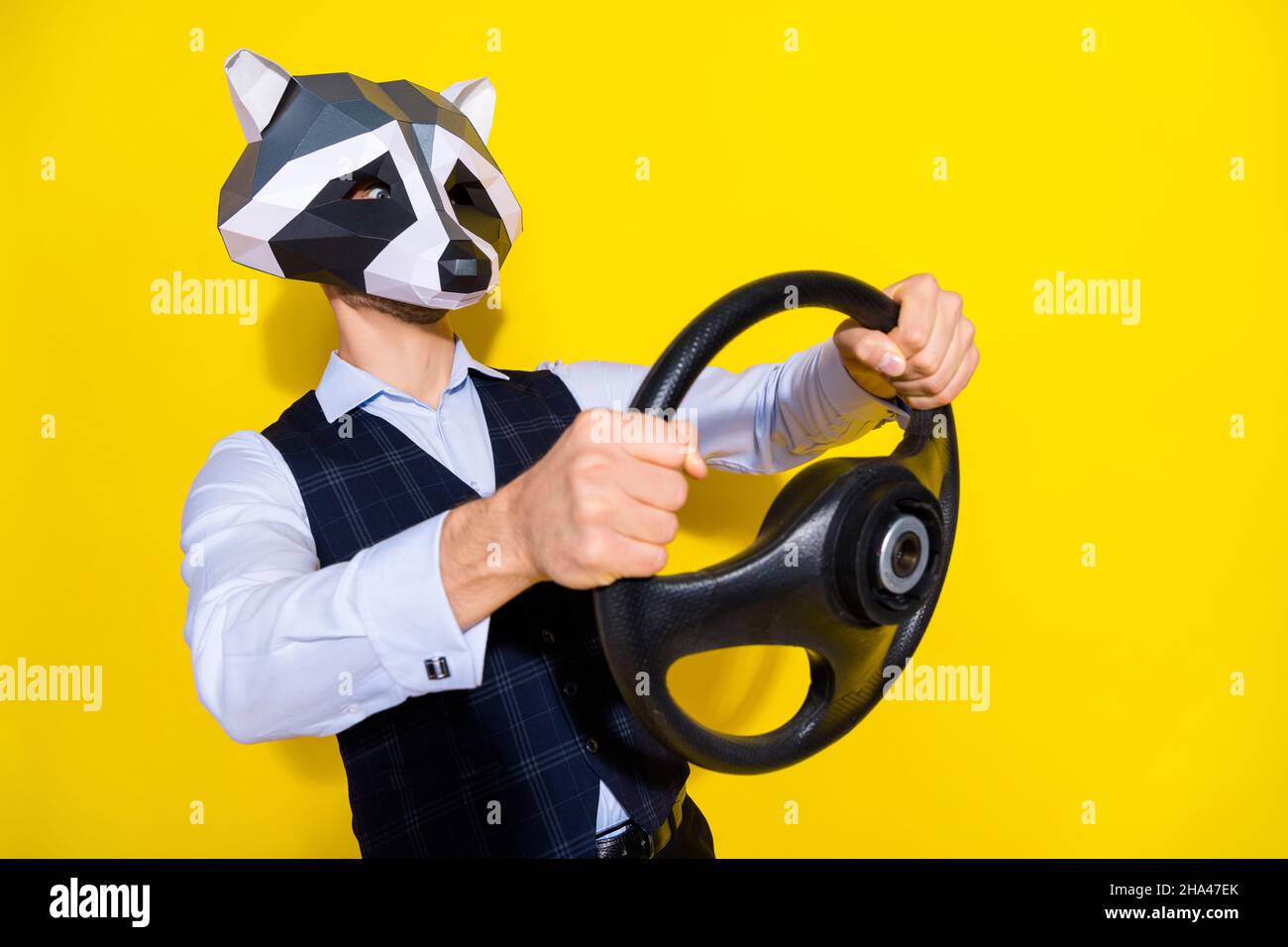 Photo of shocked weird freak guy racoon mask drive car hurry theme ...