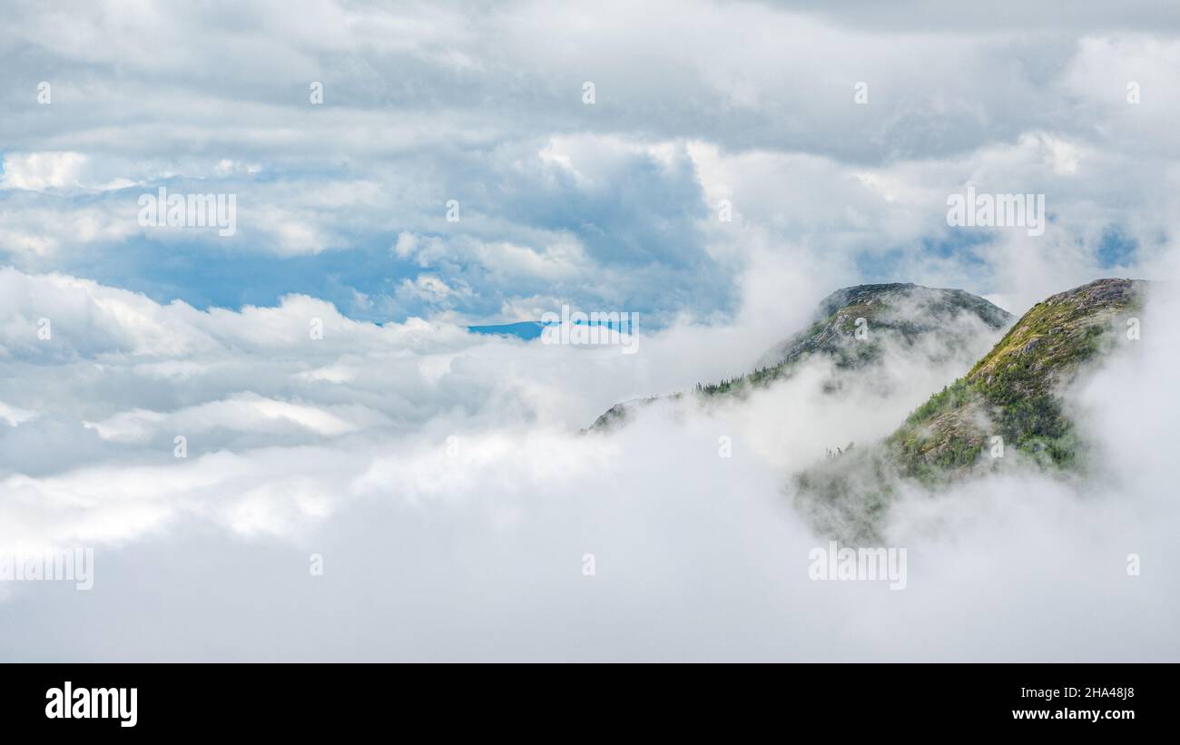 Two peaks piercing the clouds hi-res stock photography and images - Alamy