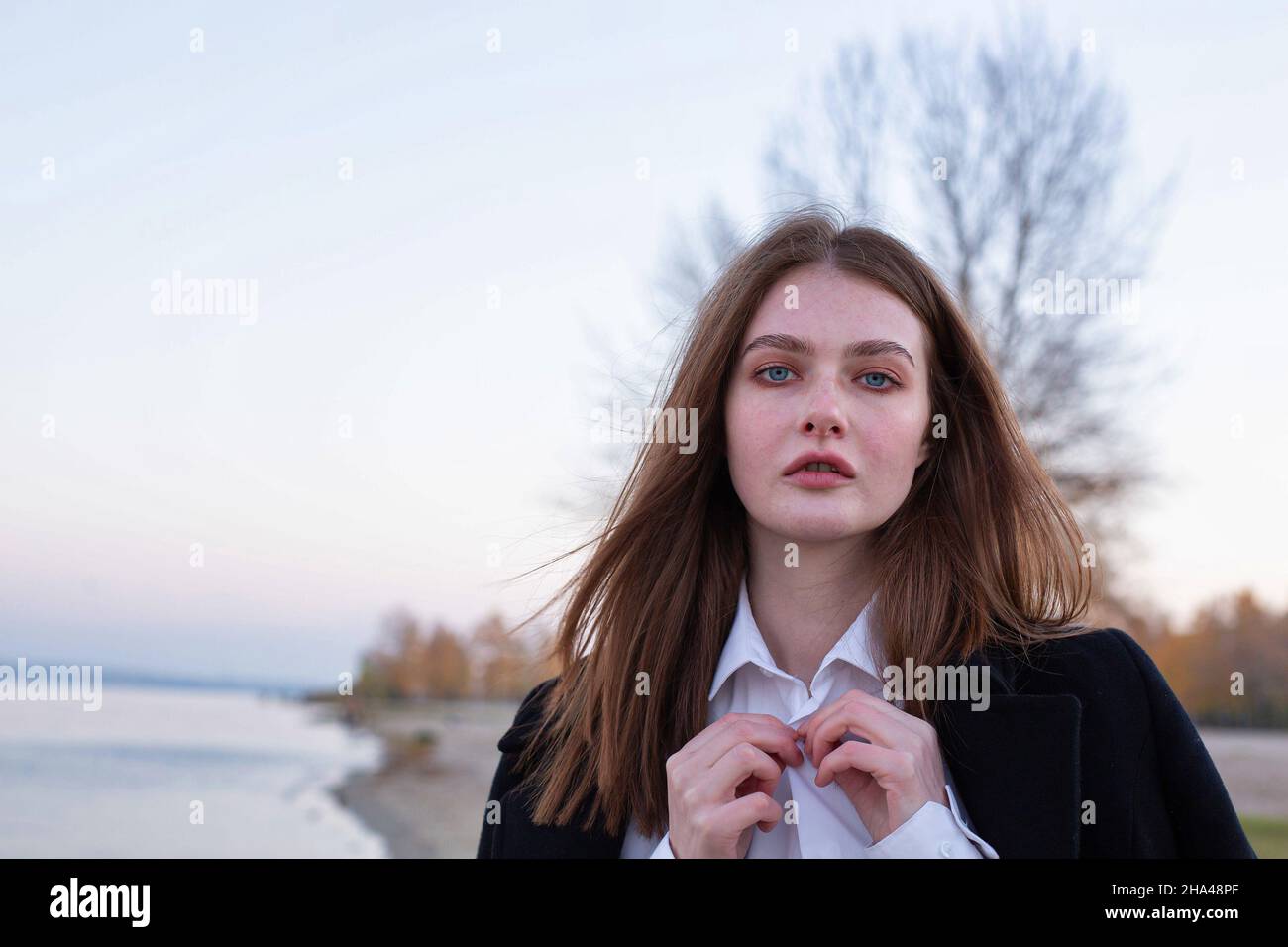 Straightening hair outdoors hi-res stock photography and images - Alamy