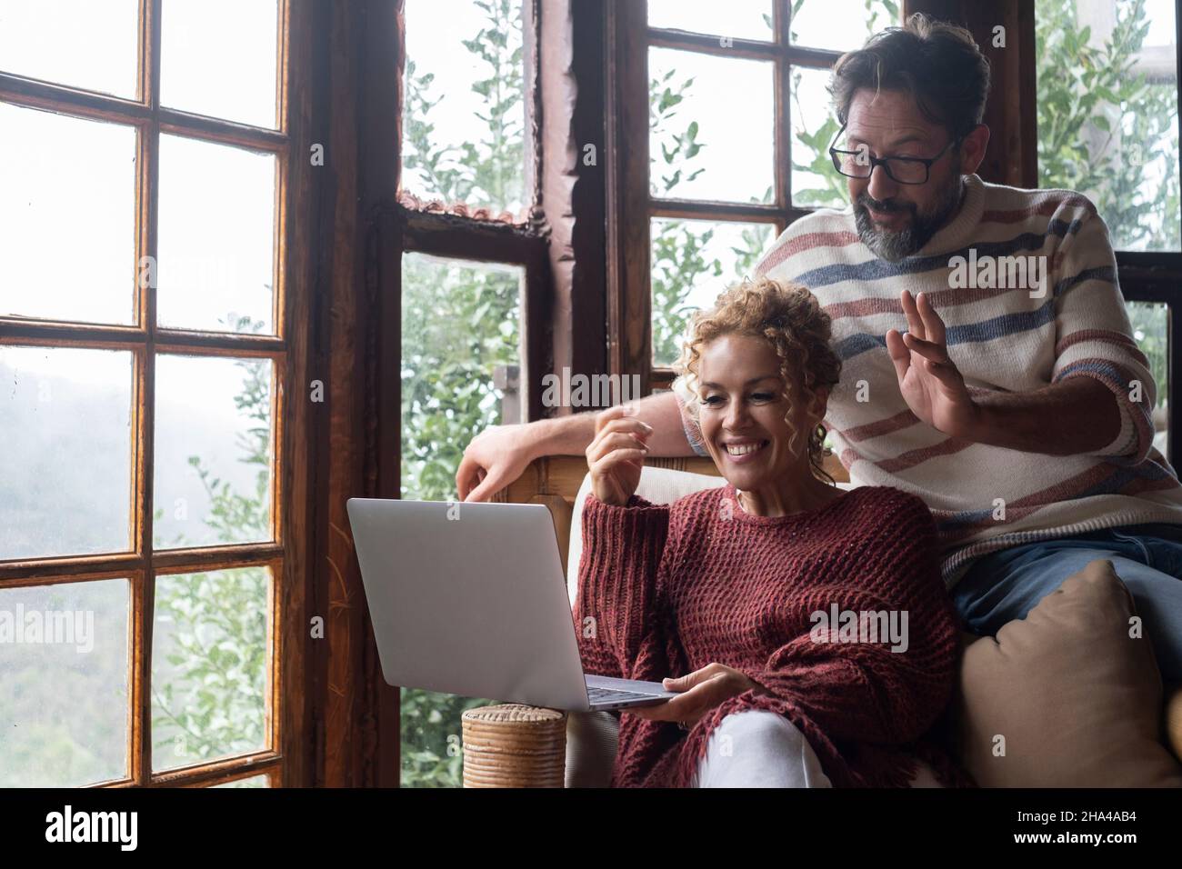 happy and excited couple man and woman do video call conference with ...