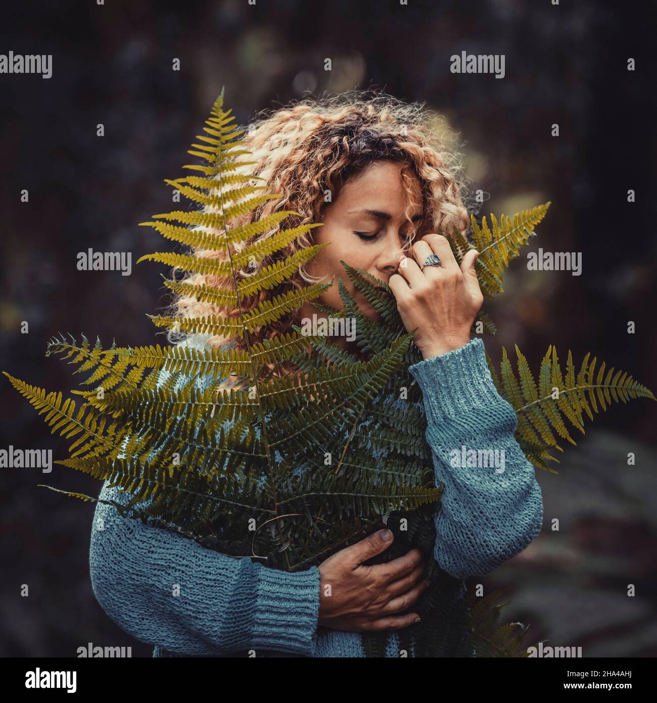 people and nature love concept lifestyle. woman embracing big plant ...