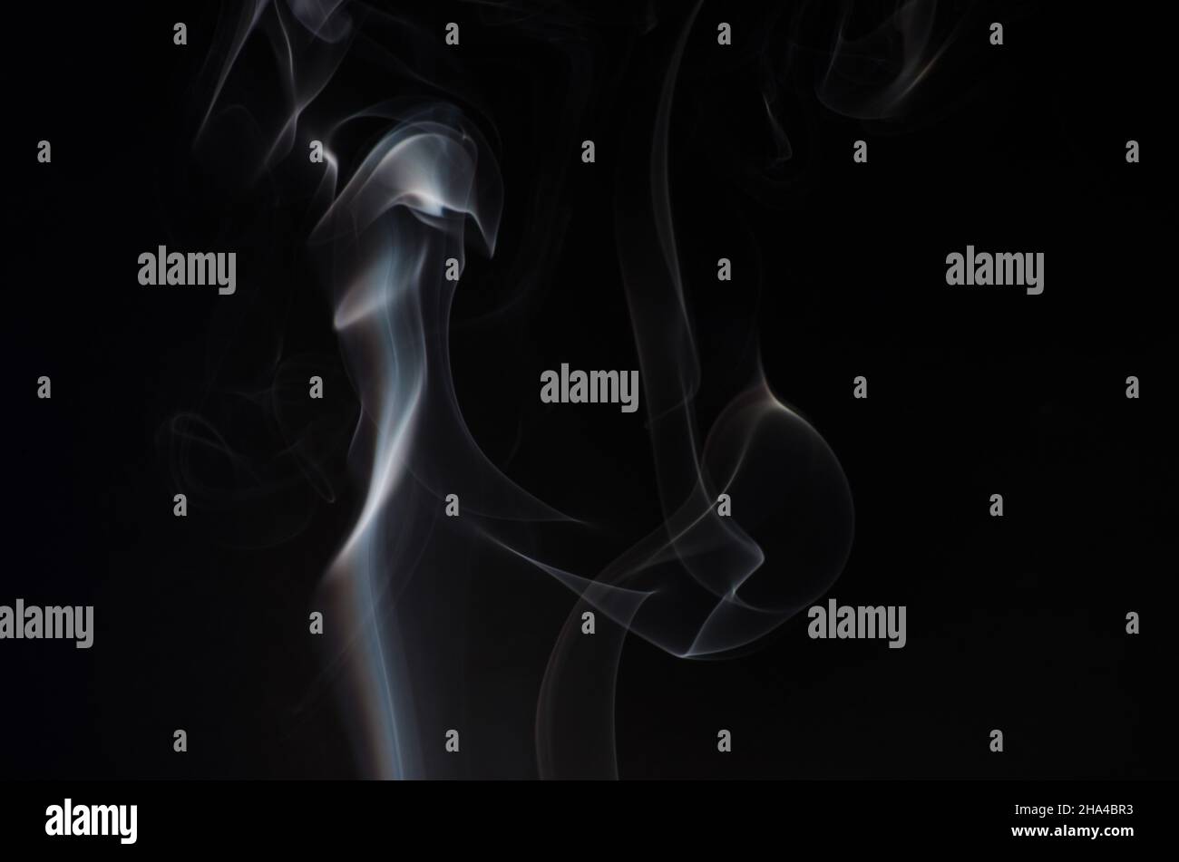 Calm smoke on the dark background Stock Photo - Alamy