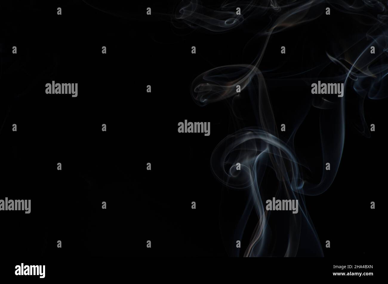 Calm smoke on the dark background Stock Photo - Alamy