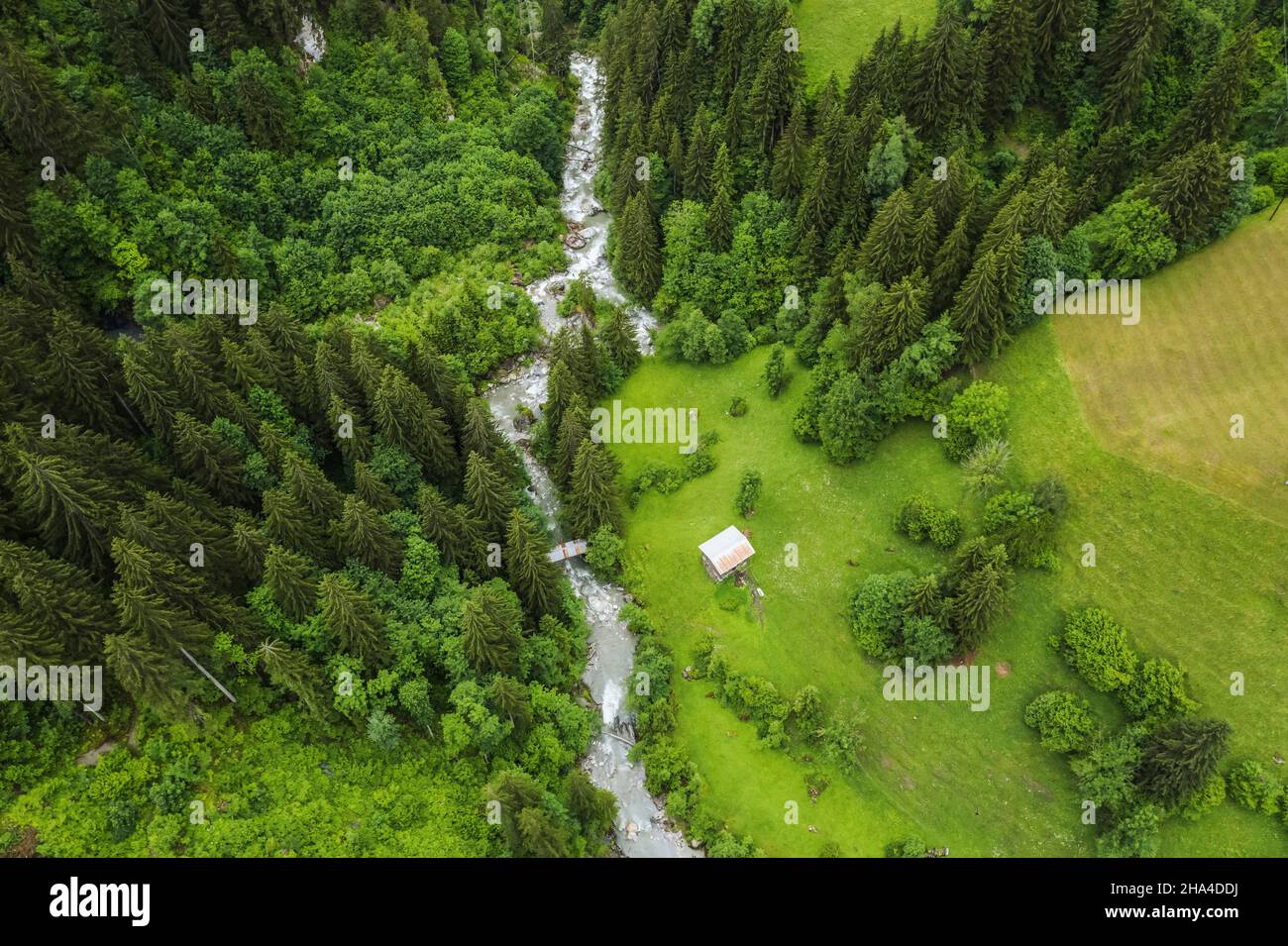 aerial birds eye view showing epic krimml waterfalls surrounded by big ...