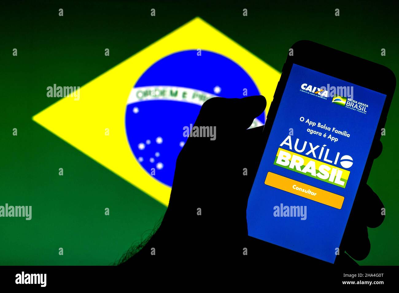 In this photo illustration an Auxilio Brasil app seen displayed on a ...