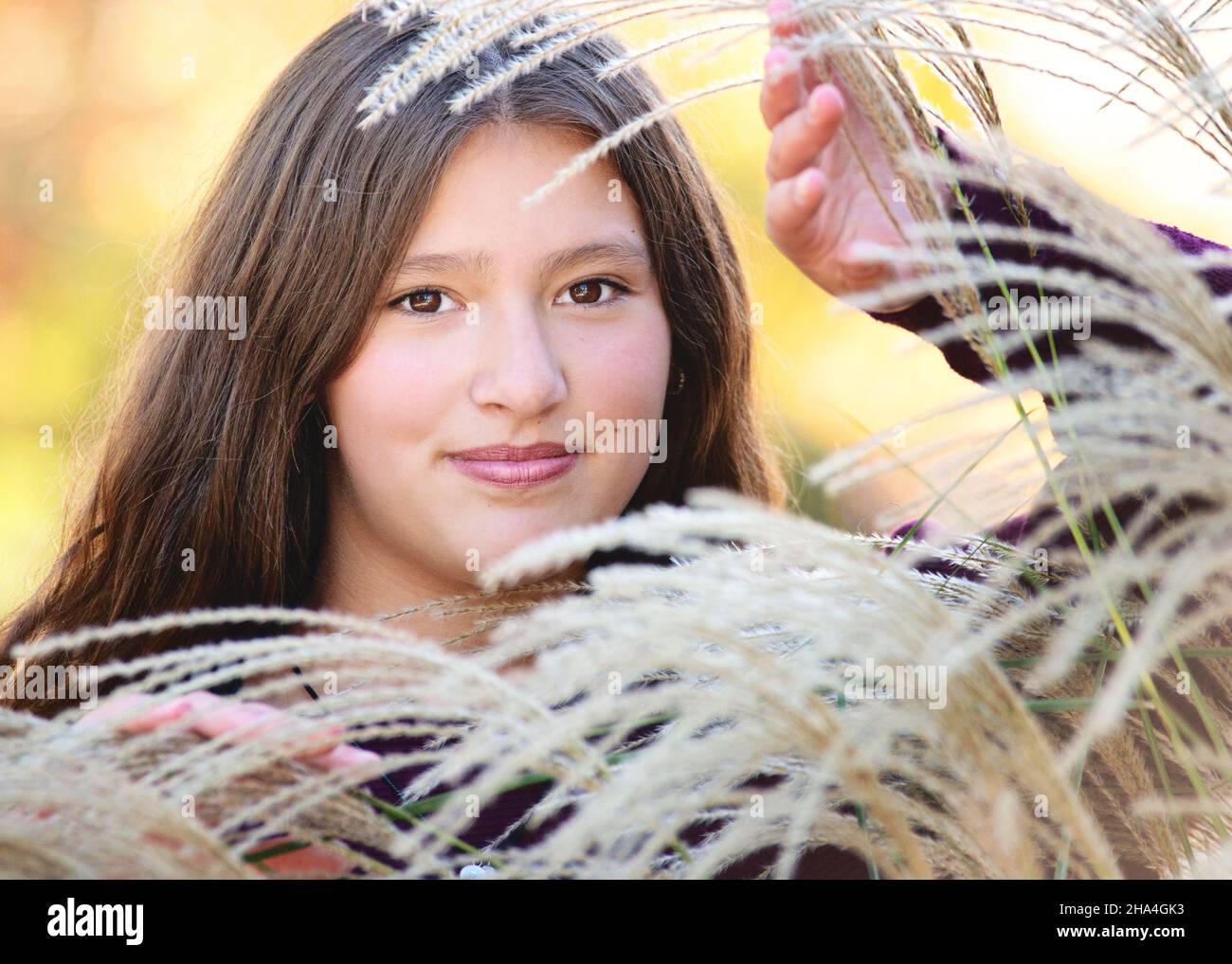 Beautiful happy tween girl outdoors in fall colors Stock Photo - Alamy