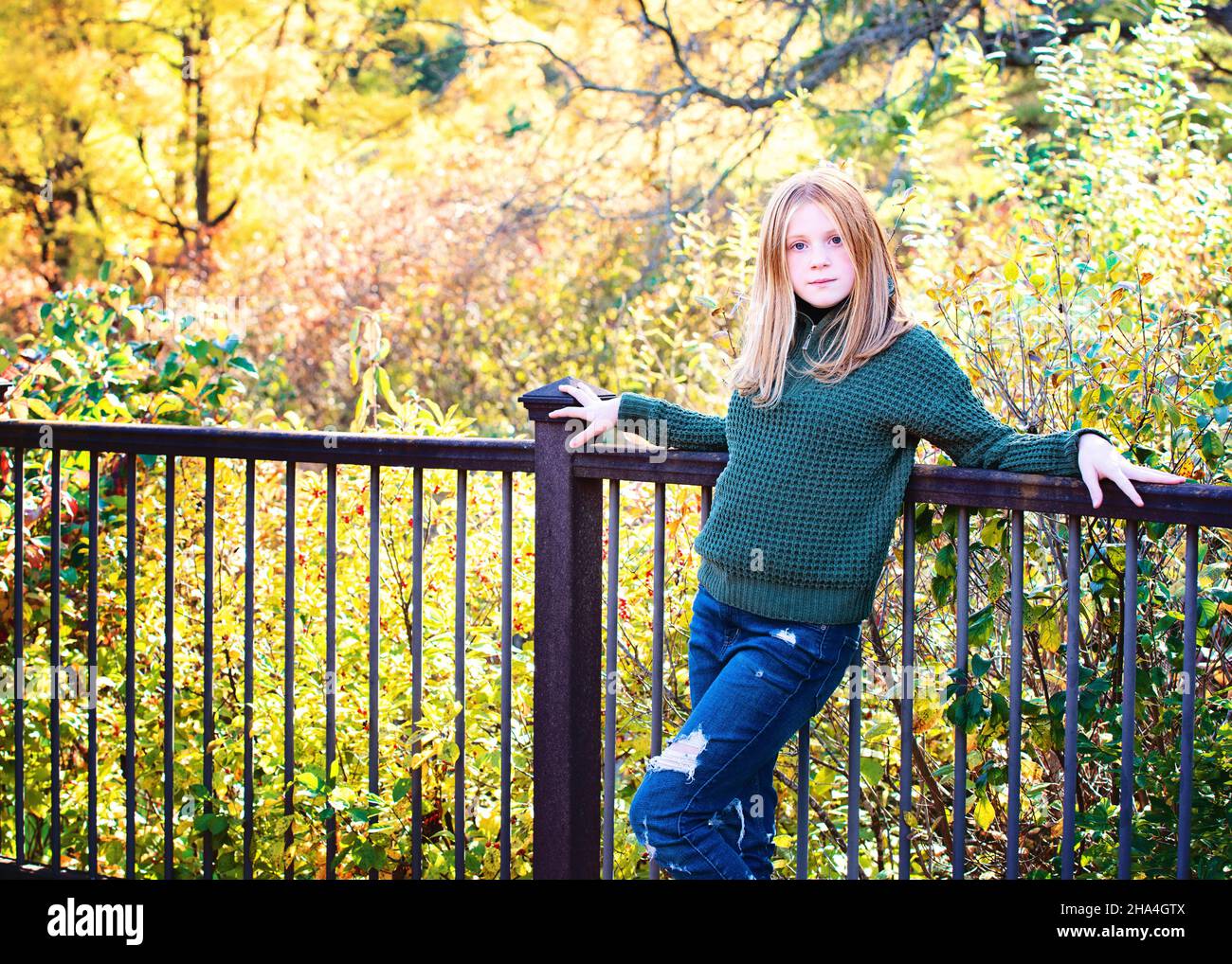 Pretty tween girl with red hair outdoors in fall colors Stock Photo - Alamy