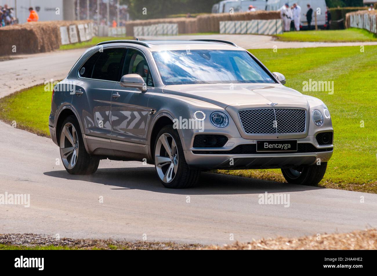 Bentley Bentayga luxury SUV car driving up the hill climb track at the ...