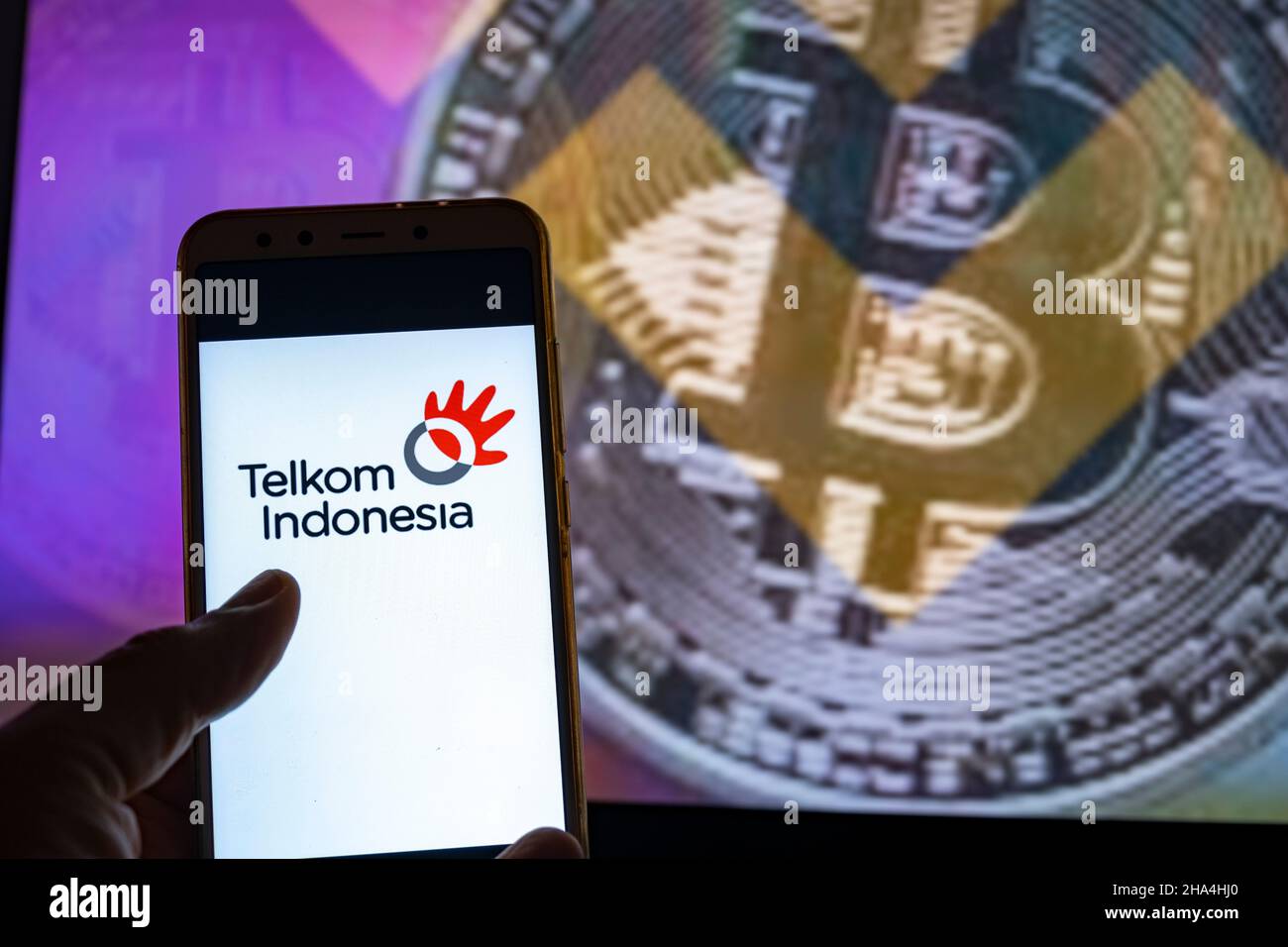 In this photo illustration the Telkom Indonesia logo is seen on the ...