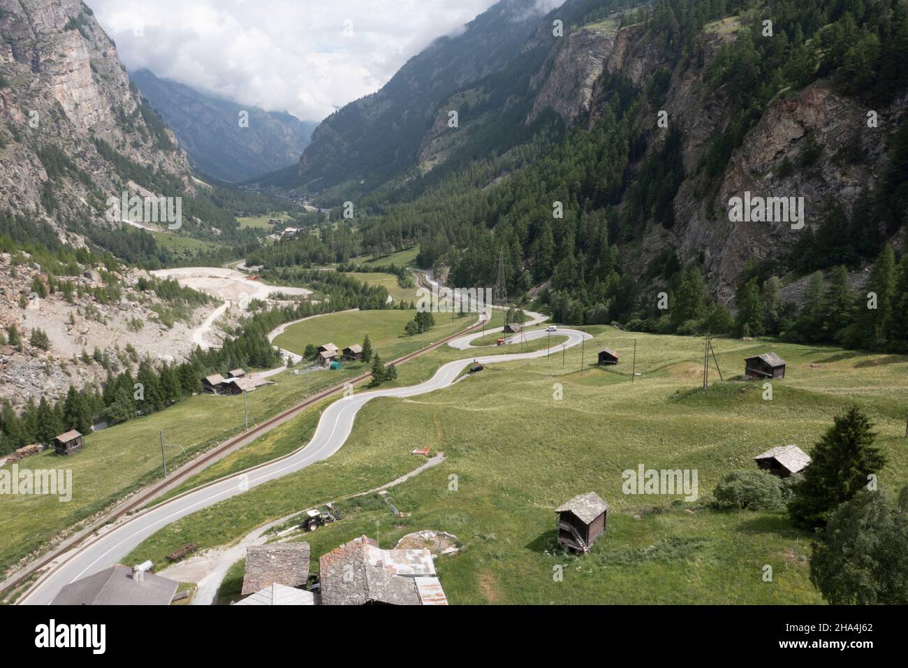 swiss valley with curves and tipical houses from aerial view Stock ...