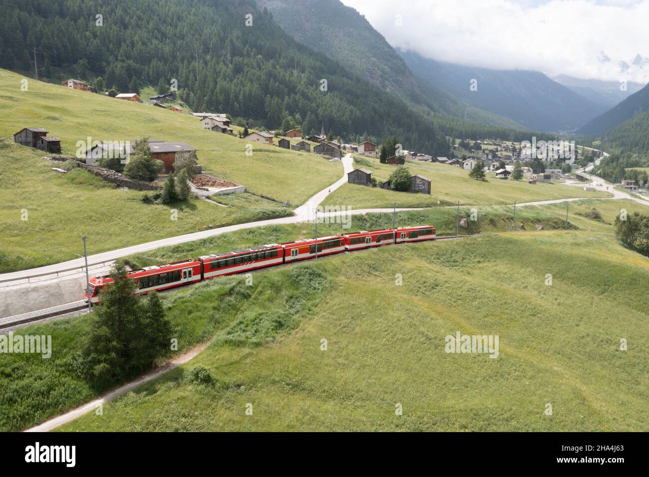 red train over valley from aerial view Stock Photo - Alamy