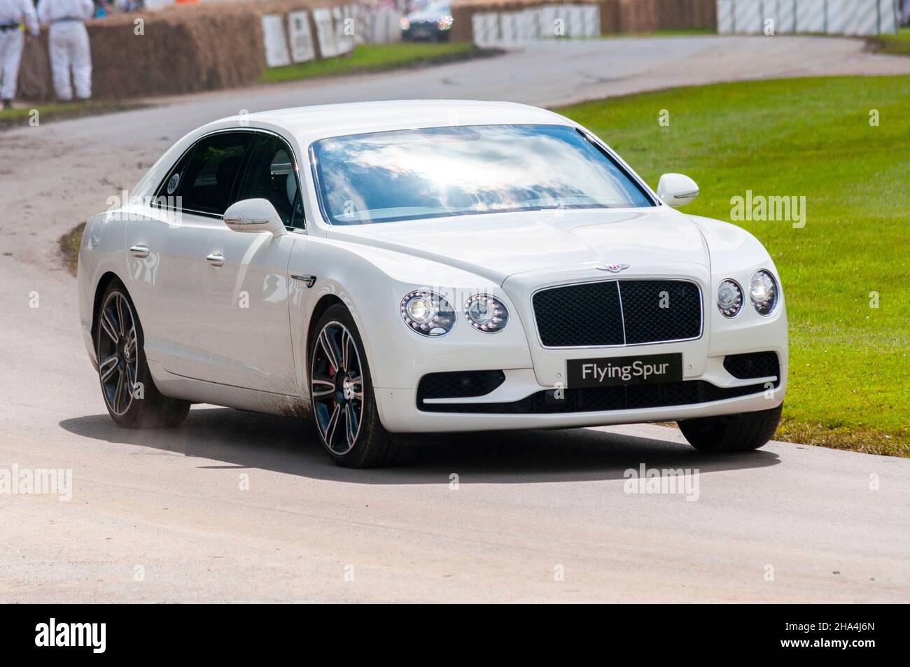 Bentley Flying Spur V8 S luxury saloon car driving up the hill climb ...