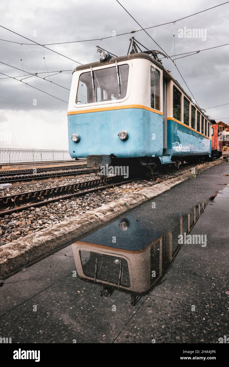 old blue train waiting over rails Stock Photo - Alamy