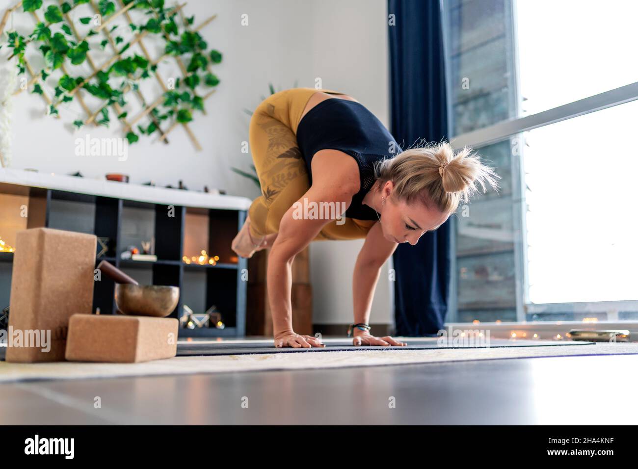 yoga teacher performing complicated yoga exercises Stock Photo - Alamy