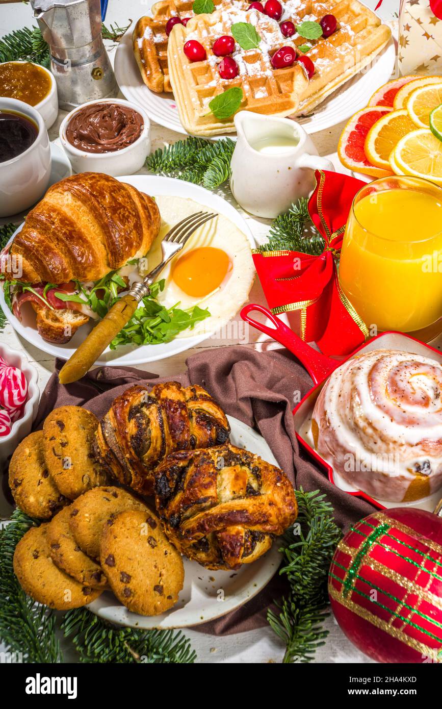 Festive Christmas morning breakfast or brunch table, with traditional ...