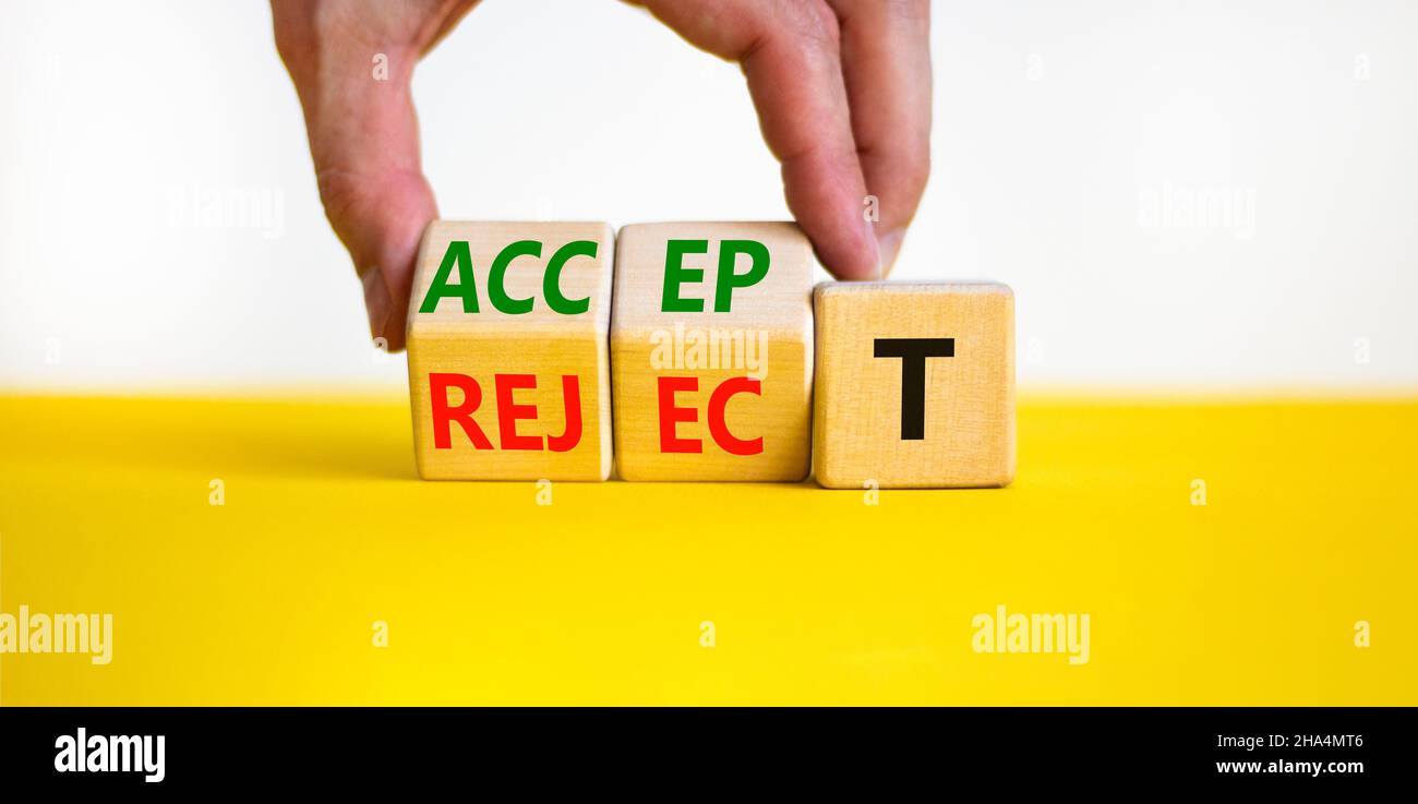 Accept or reject symbol. Businessman turns wooden cubes and changes the ...