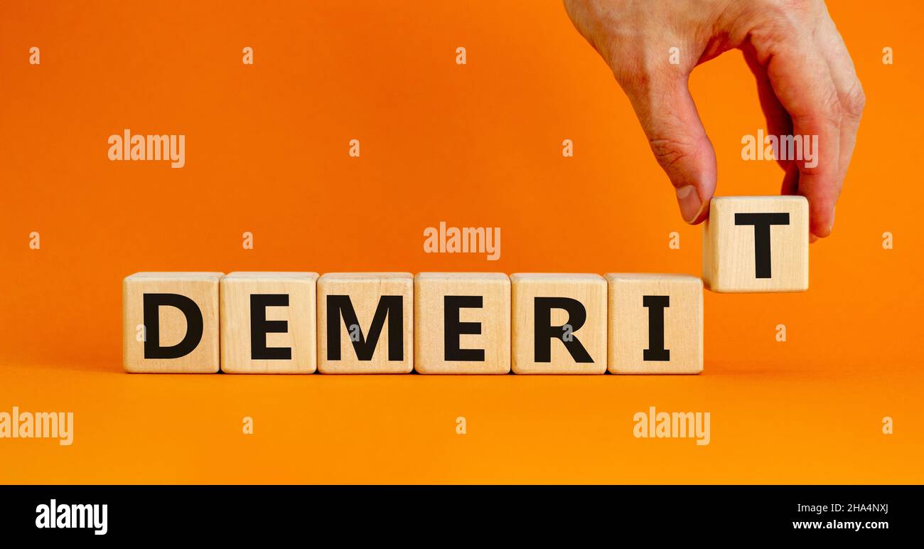 Demerit symbol. The concept word Demerit on wooden cubes. Beautiful ...