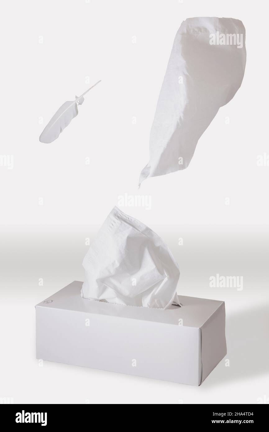 tissues floating out of a tissue box on a white background Stock Photo ...