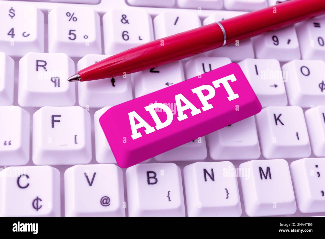 Hand writing sign Adapt. Conceptual photo Make suitable for a new use ...