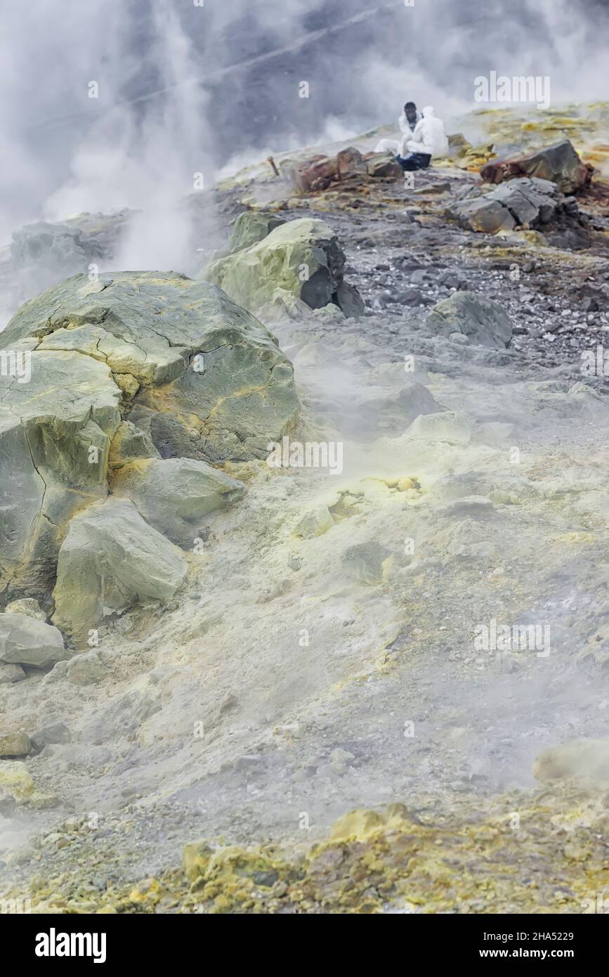 Volcanologists collecting minerals samples on Gran Cratere, Vulcano ...