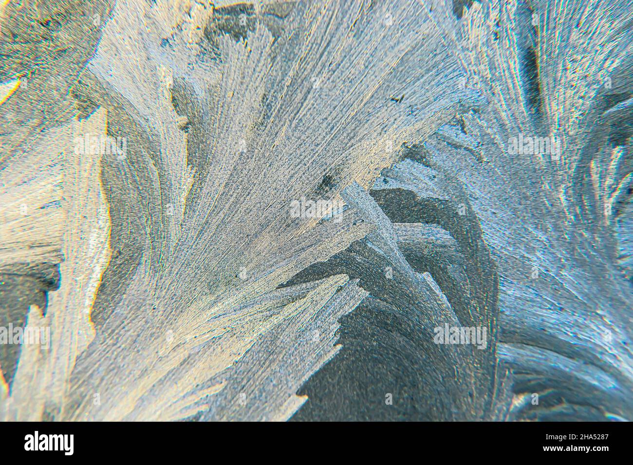 Frozen winter window with shiny ice frost pattern texture. Christmas ...