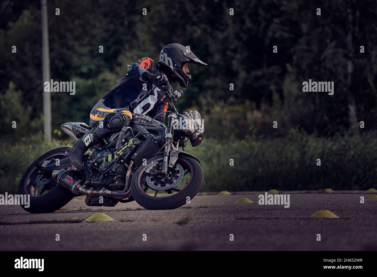 19-09-2021 Riga, Latvia A young man riding a motorcycle on an open road ...