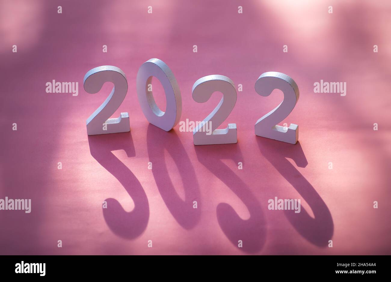 New Year 2022 sign made of wood on festive background with copy space ...