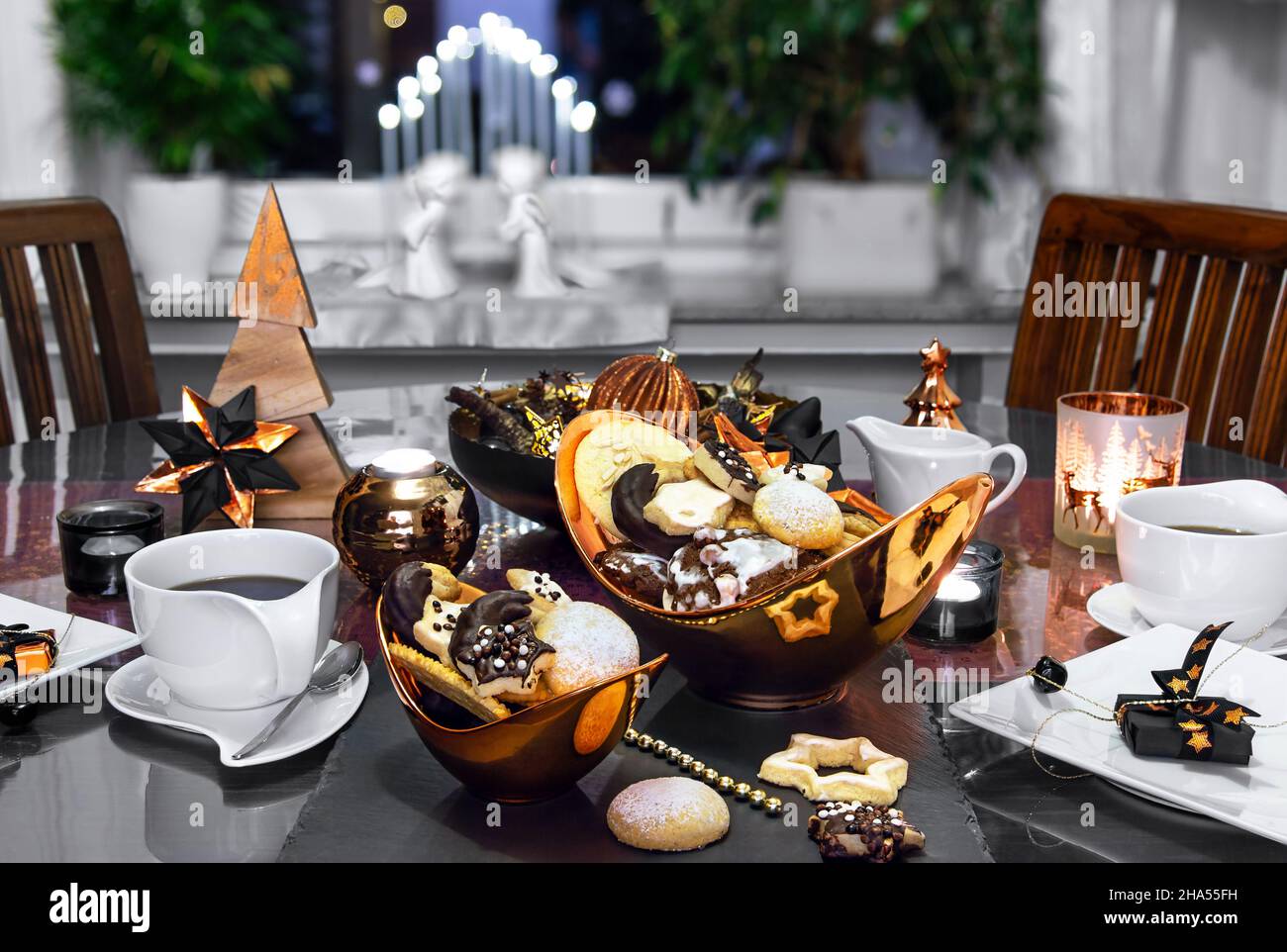 Advent season. In the dining room the table is set with bronze and ...