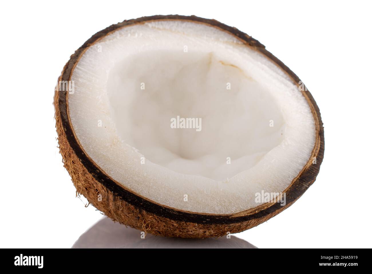 One half of a ripe organic coconut, close-up, isolated on white Stock ...